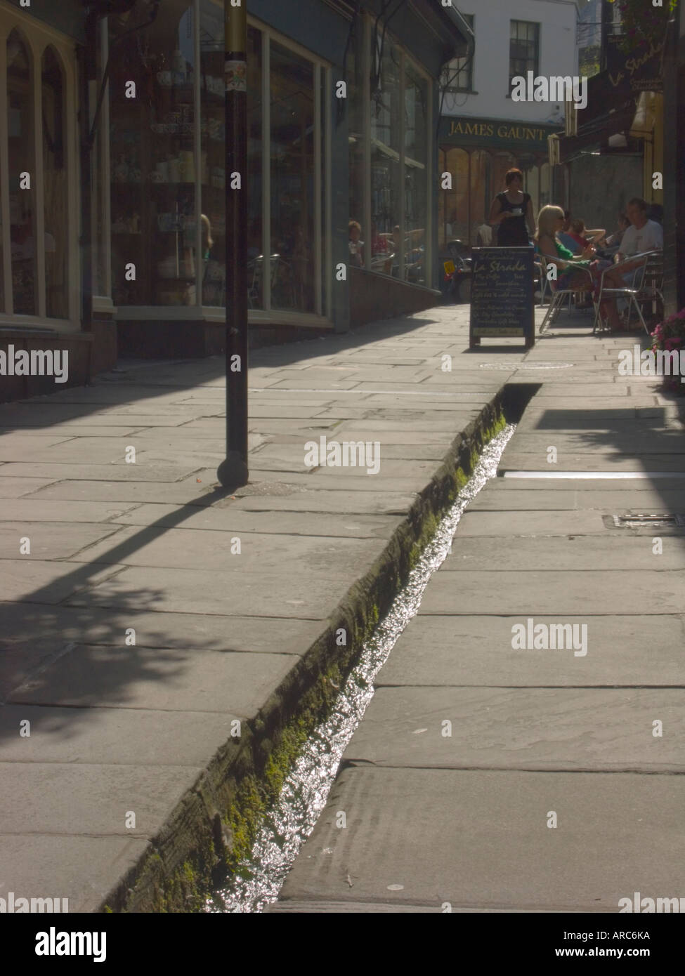 The stream running down the middle of Cheap Street in Frome Stock Photo ...