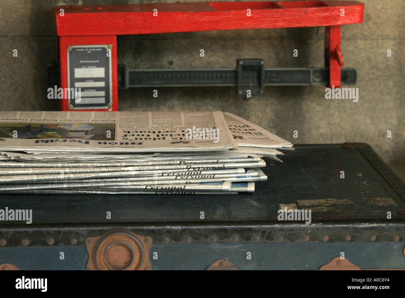 Scales and newspapers Stock Photo - Alamy