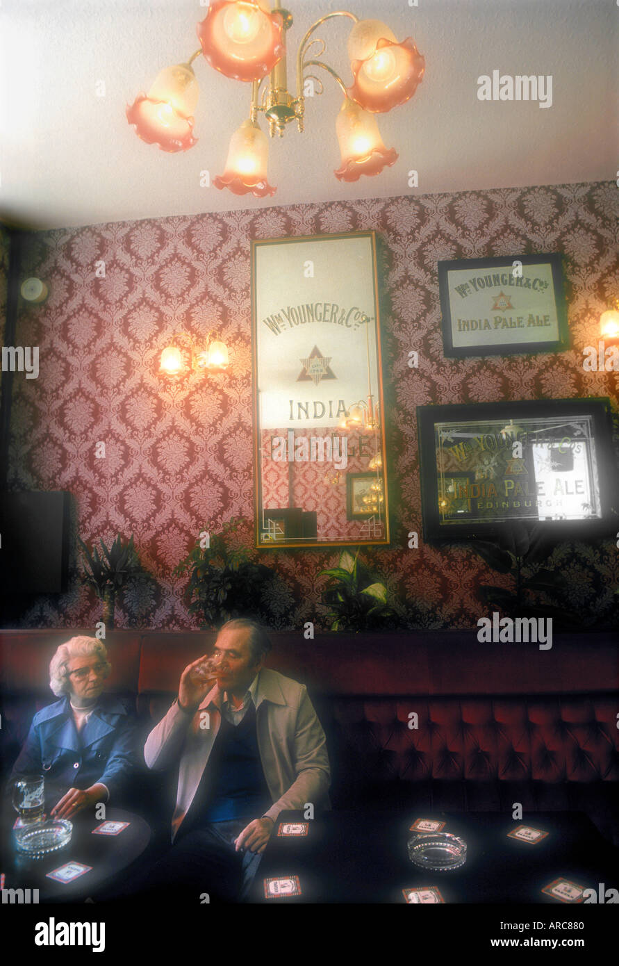 Couple drinking in traditional English Public House in East End of ...