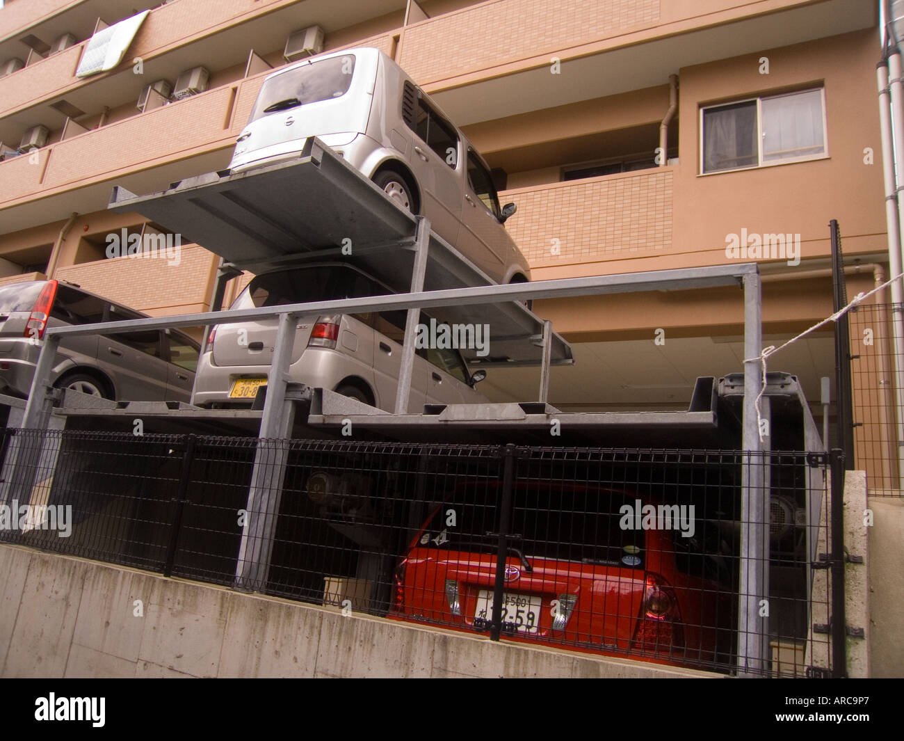 japan tokyo cars vertically double parked in apartment block Stock ...