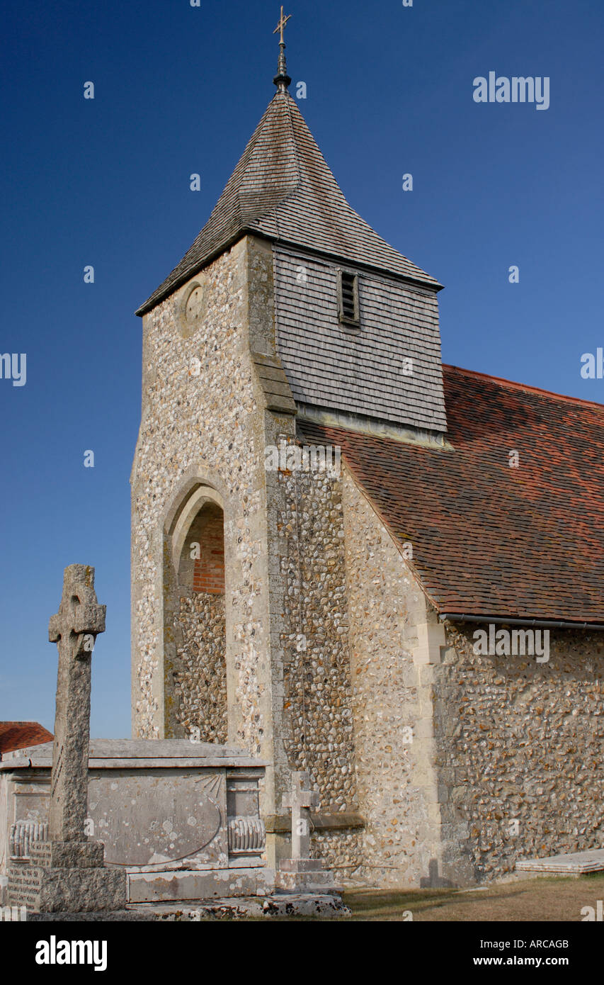 The tower tiled roof and shingled spire of St Nicholas Church West ...