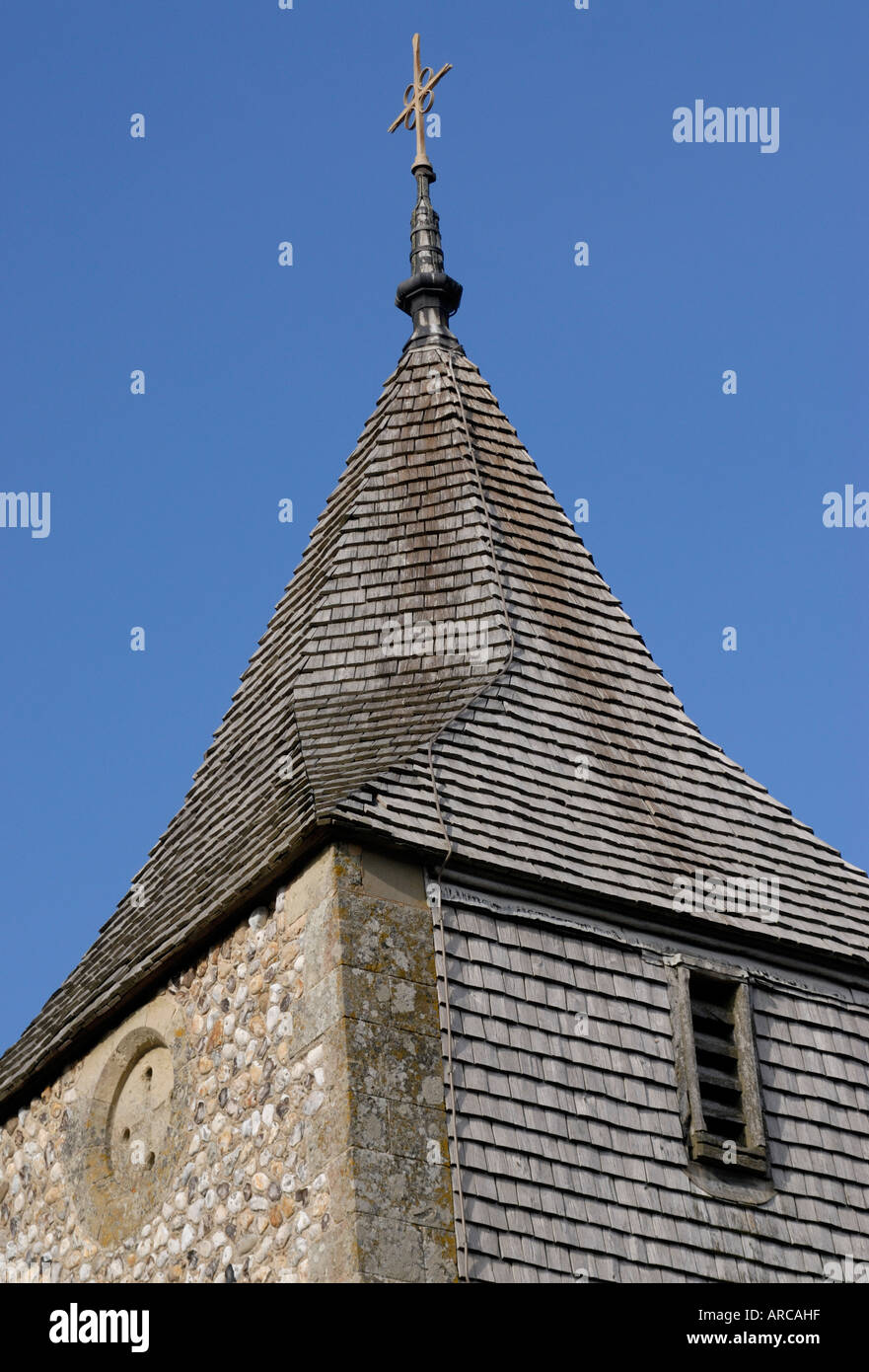 The tower and shingled spire of St Nicholas Church West Itchenor Sussex ...