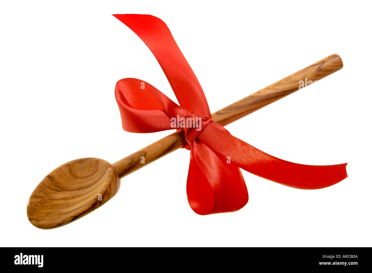 wooden cooking spoon SYMBOL SYMBOLIC with red ribbon Stock Photo - Alamy