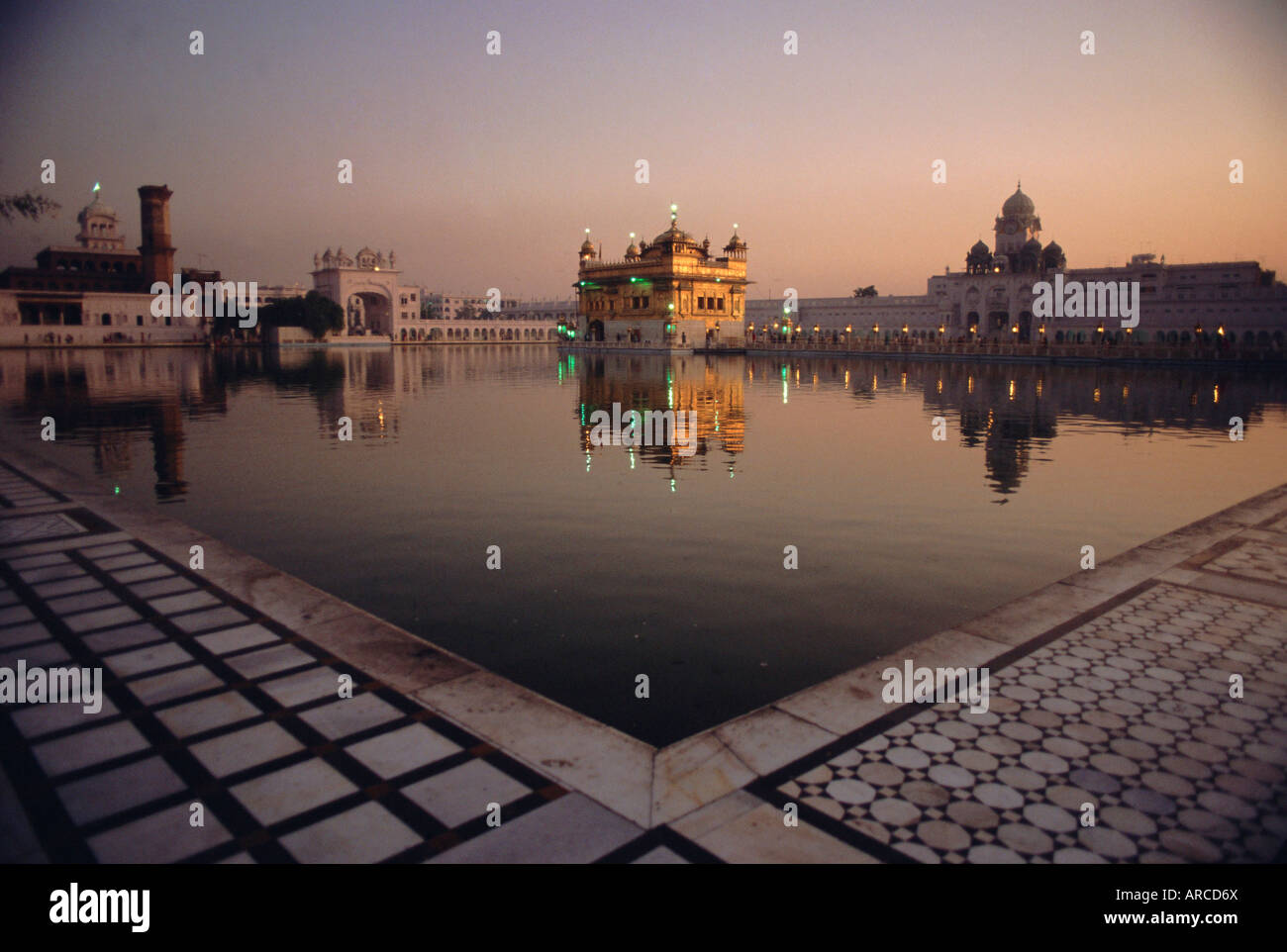 Dawn at the Golden Temple, cloisters and Holy Pool of Nectar, sacred ...