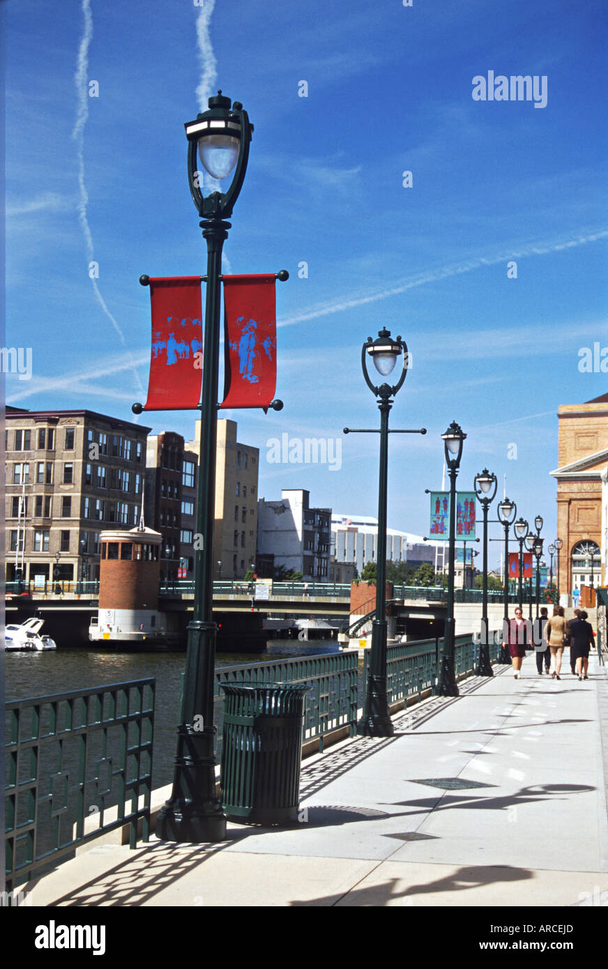 WISCONSIN Milwaukee Riverwalk along Milwaukee River sidewalk with ...