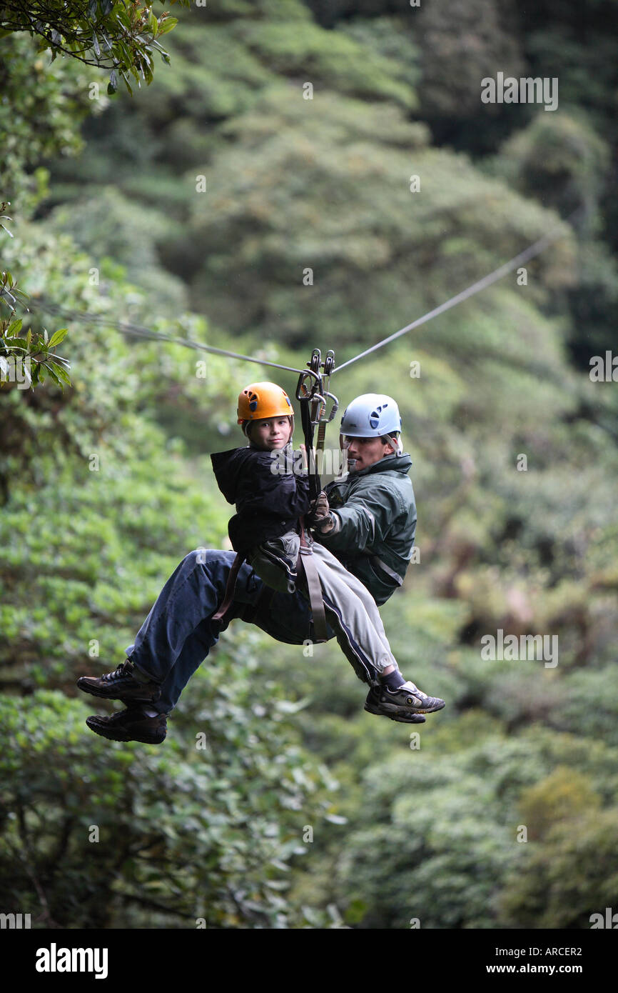Vertical action portrait of young boy on family adventure holiday on ...