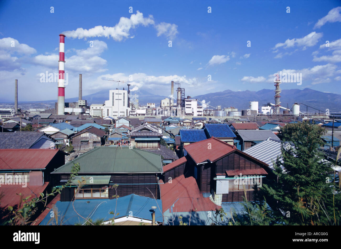 Industrial complex of paper mill and city skyline, Yoshiwara, Japan ...