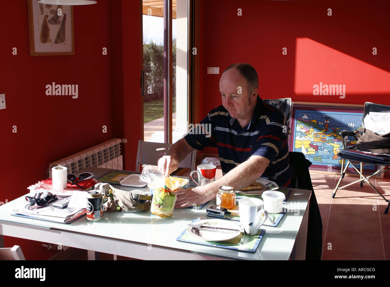 Man having breakfast Stock Photo - Alamy