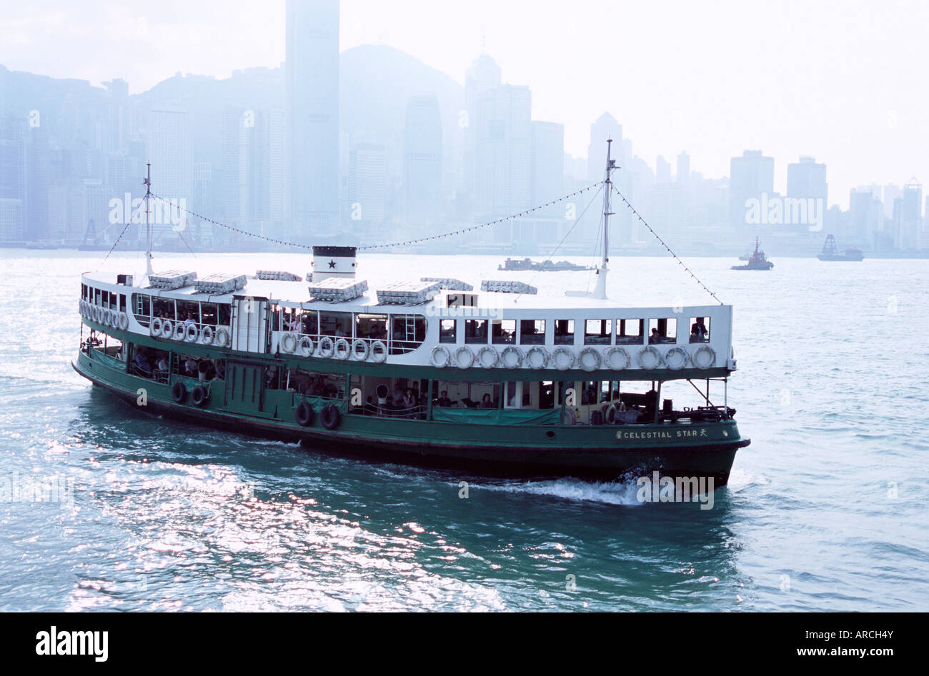 Star Ferry, Victoria Harbour, with Hong Kong Island skyline in mist ...