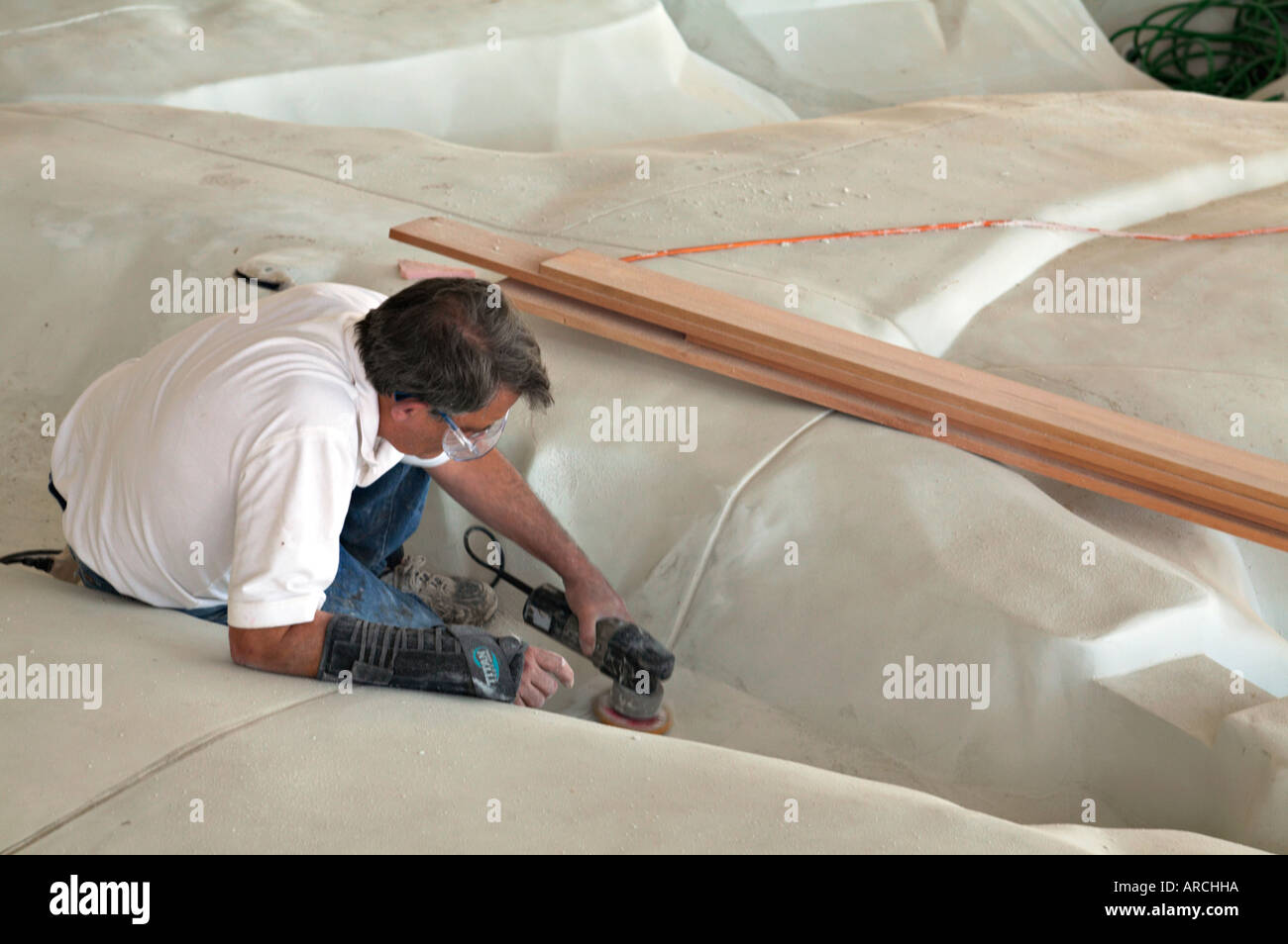 WISCONSIN Milwaukee Man using sander on exhibit construction at ...