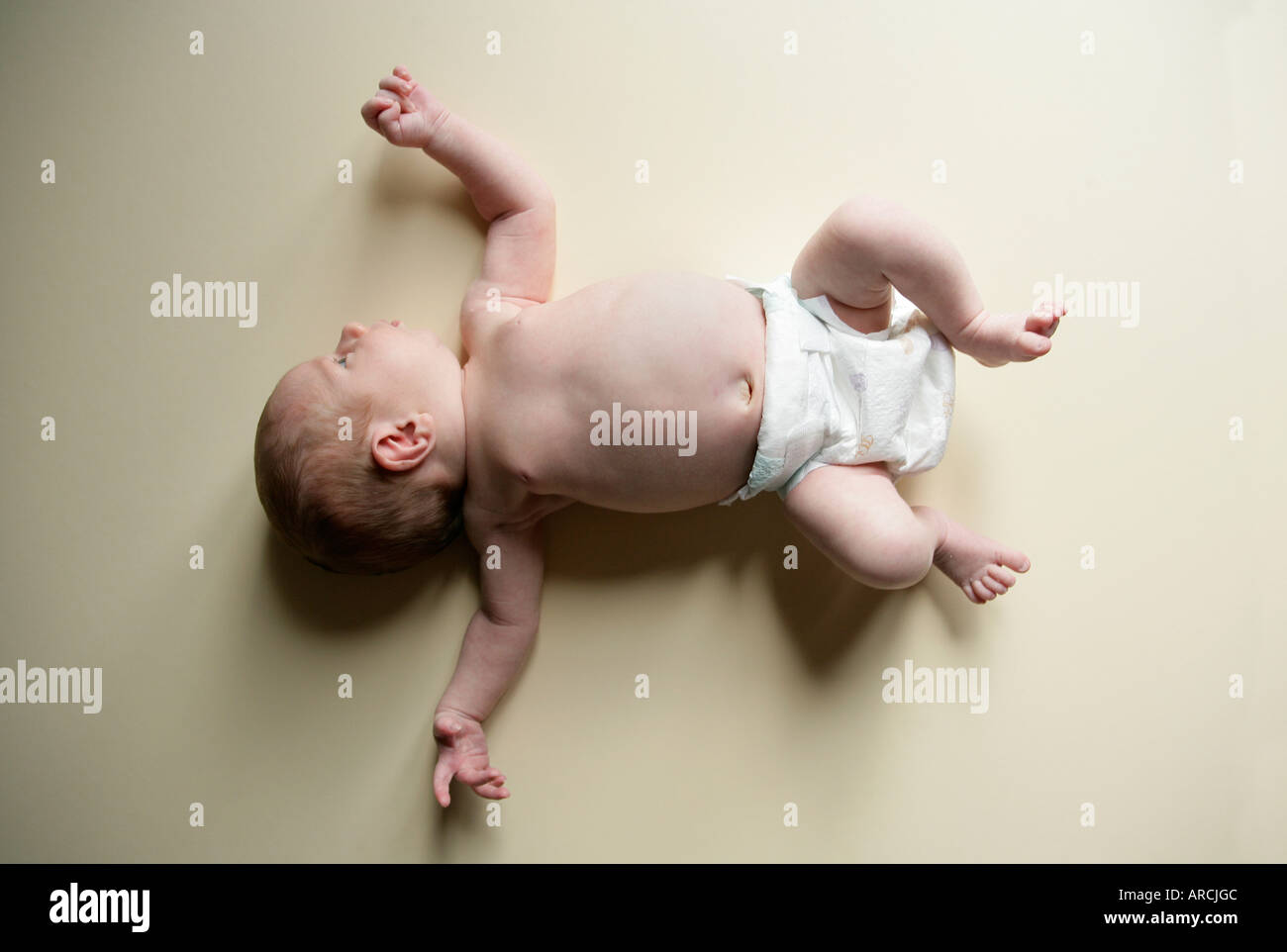 Baby lying on back Stock Photo - Alamy