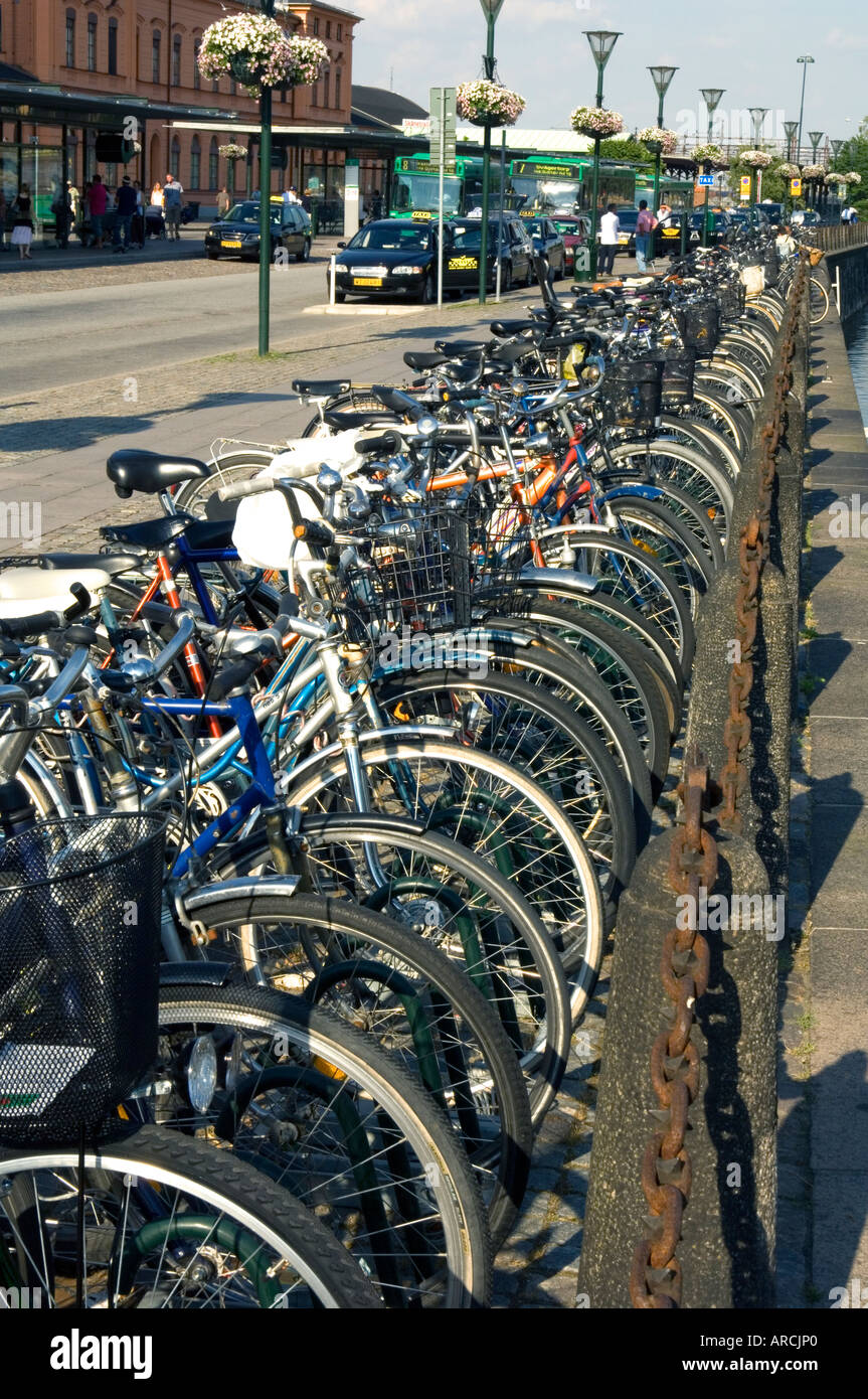 A line of bicycles parked in front of the central railway and bus ...