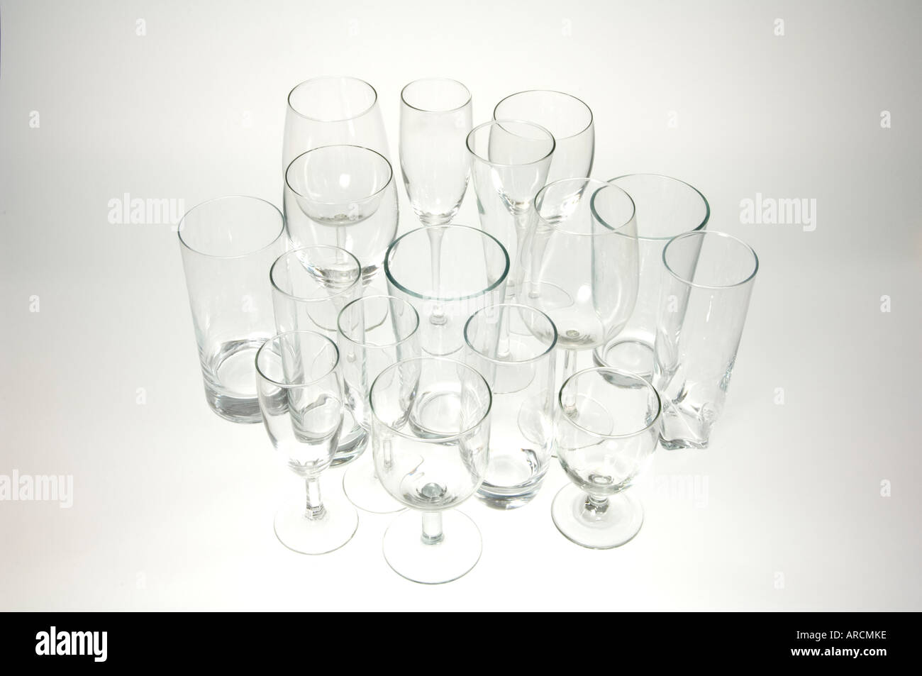 A group of empty clean glasses of all shapes and sizes Stock Photo - Alamy