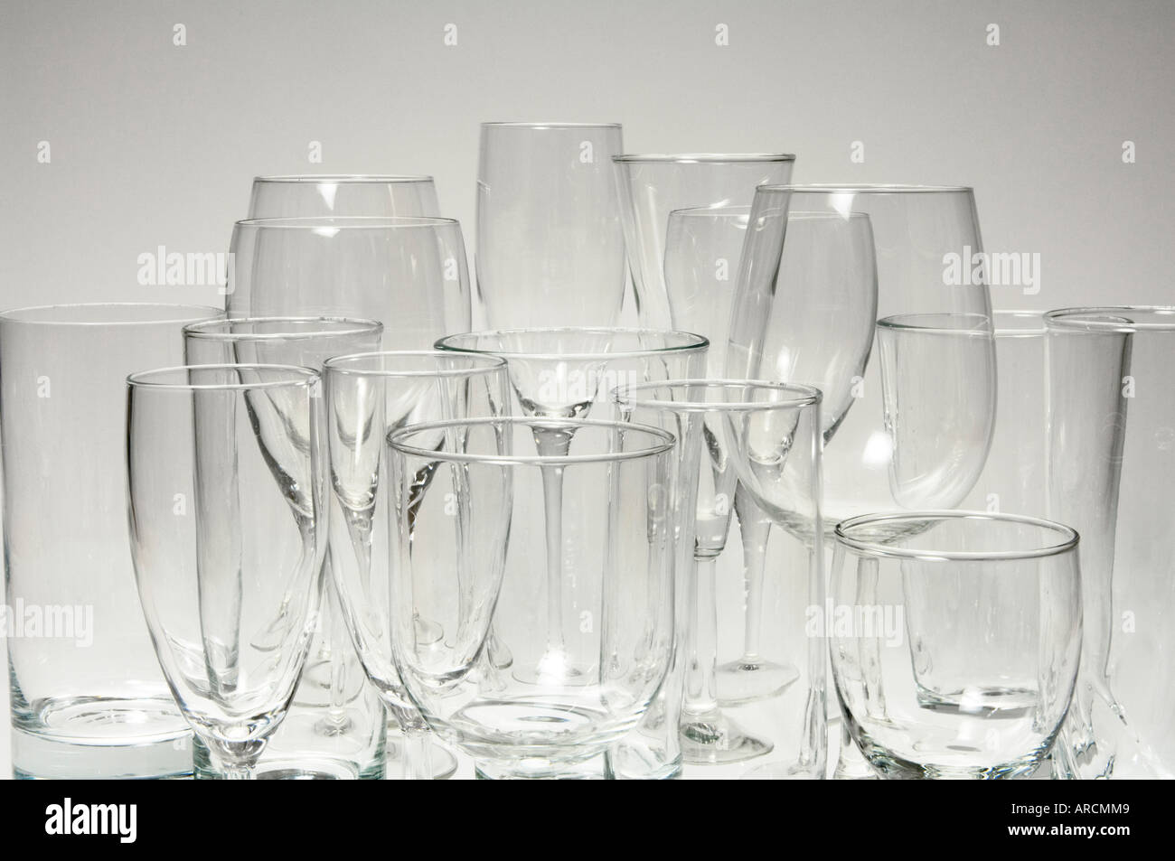A group of empty clean glasses of all shapes and sizes Stock Photo - Alamy