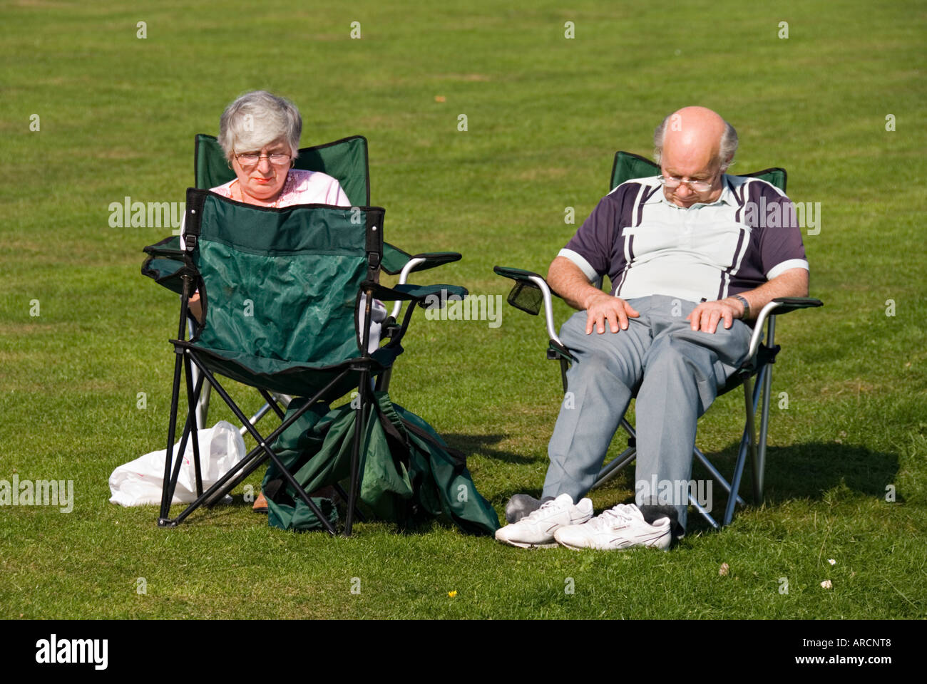 Couple sleeping in chairs on hi-res stock photography and images - Alamy