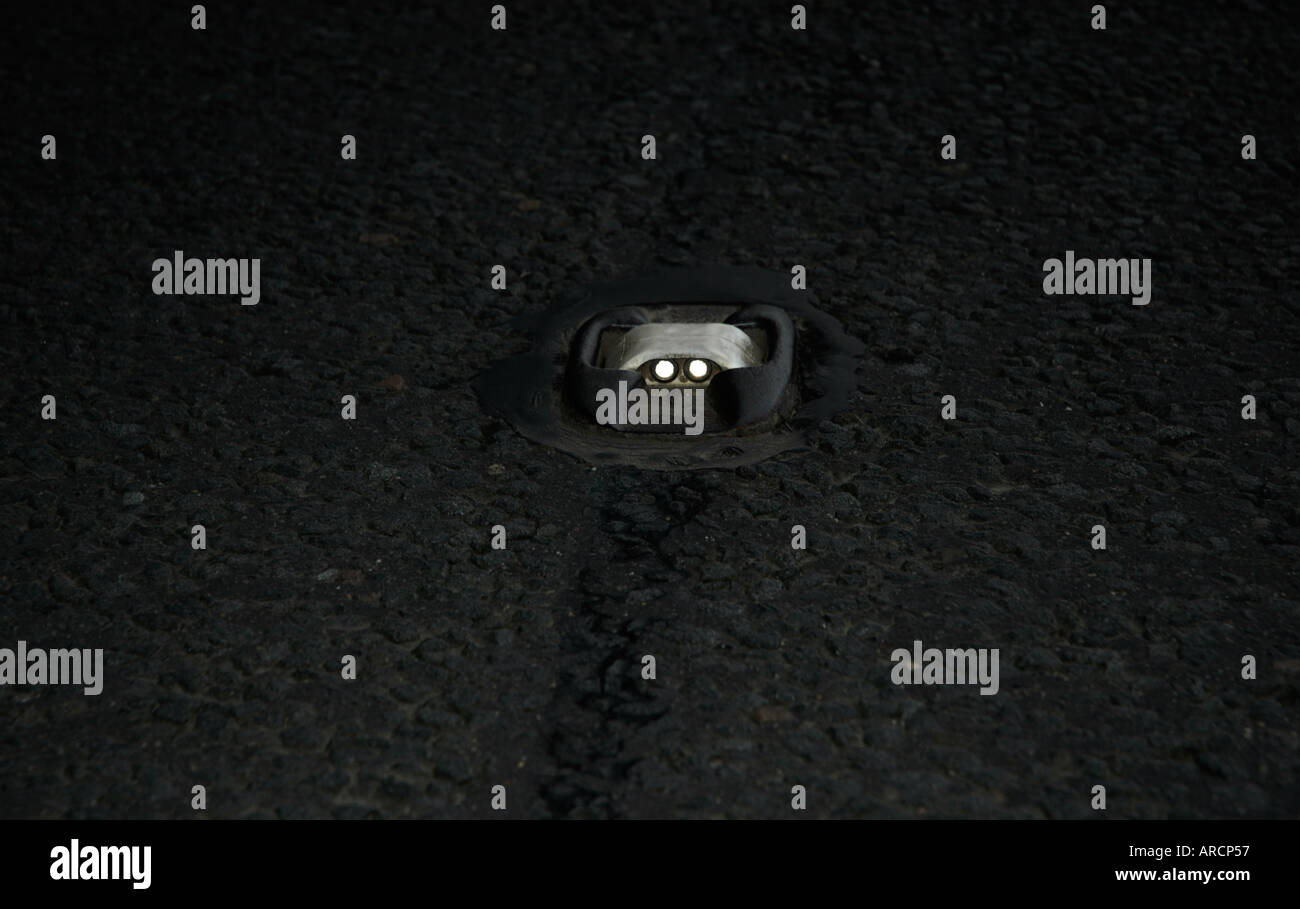 Cat's eye road marker with reflecting lights Stock Photo - Alamy