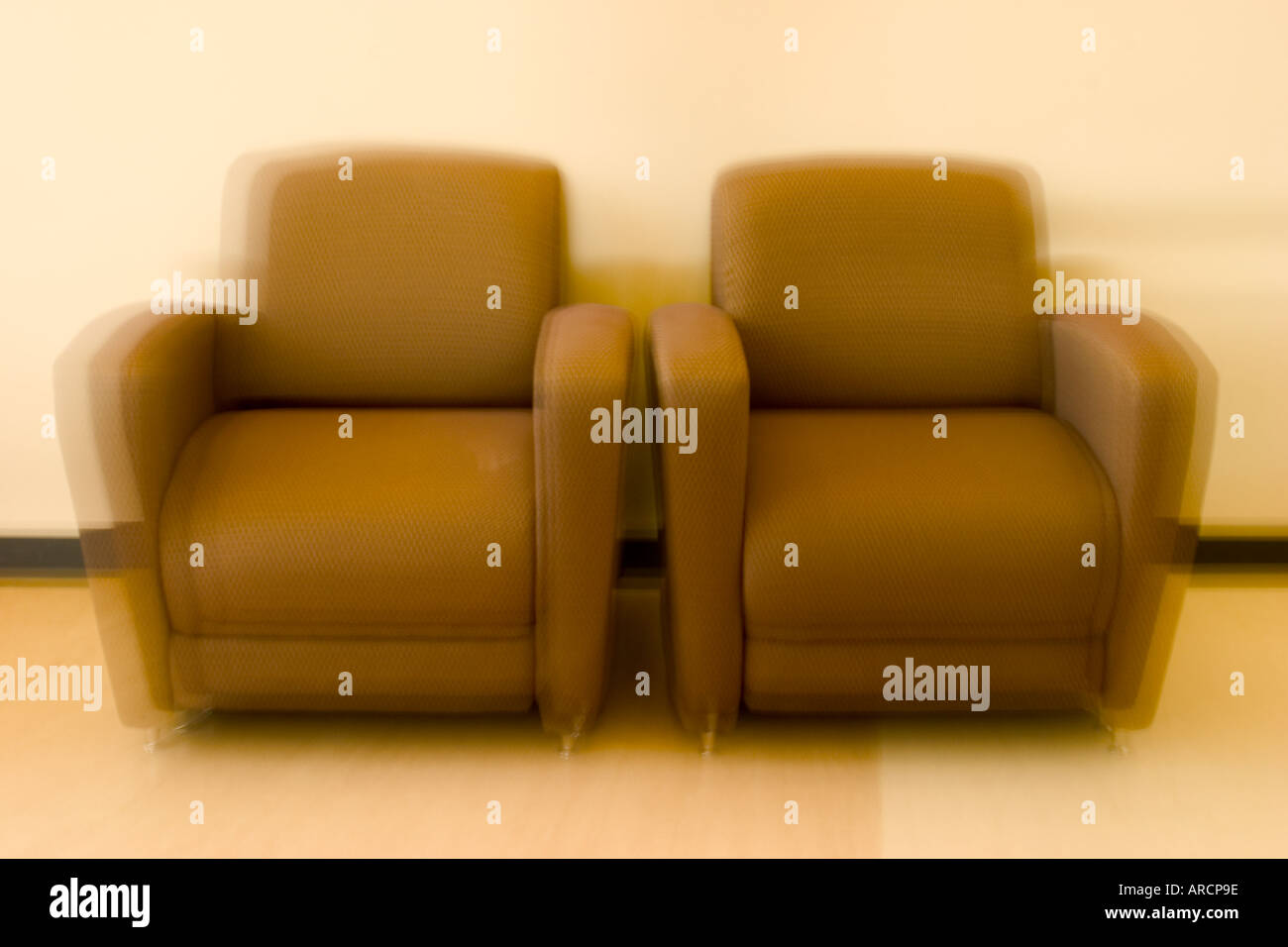 Two chairs in the lobby of an office building Stock Photo - Alamy