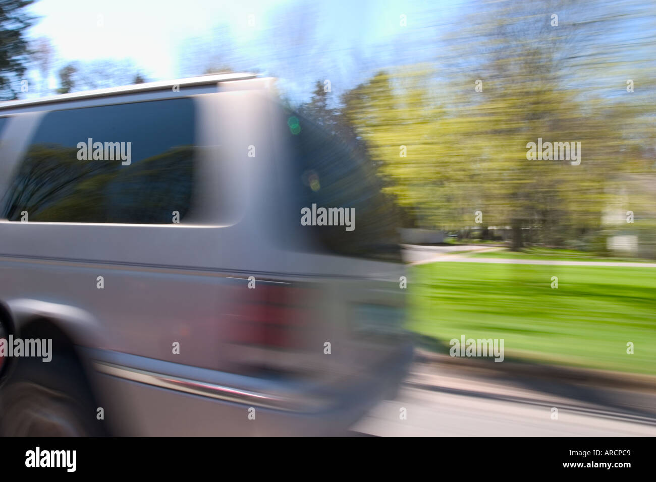 Back end of a van speeding by Stock Photo - Alamy