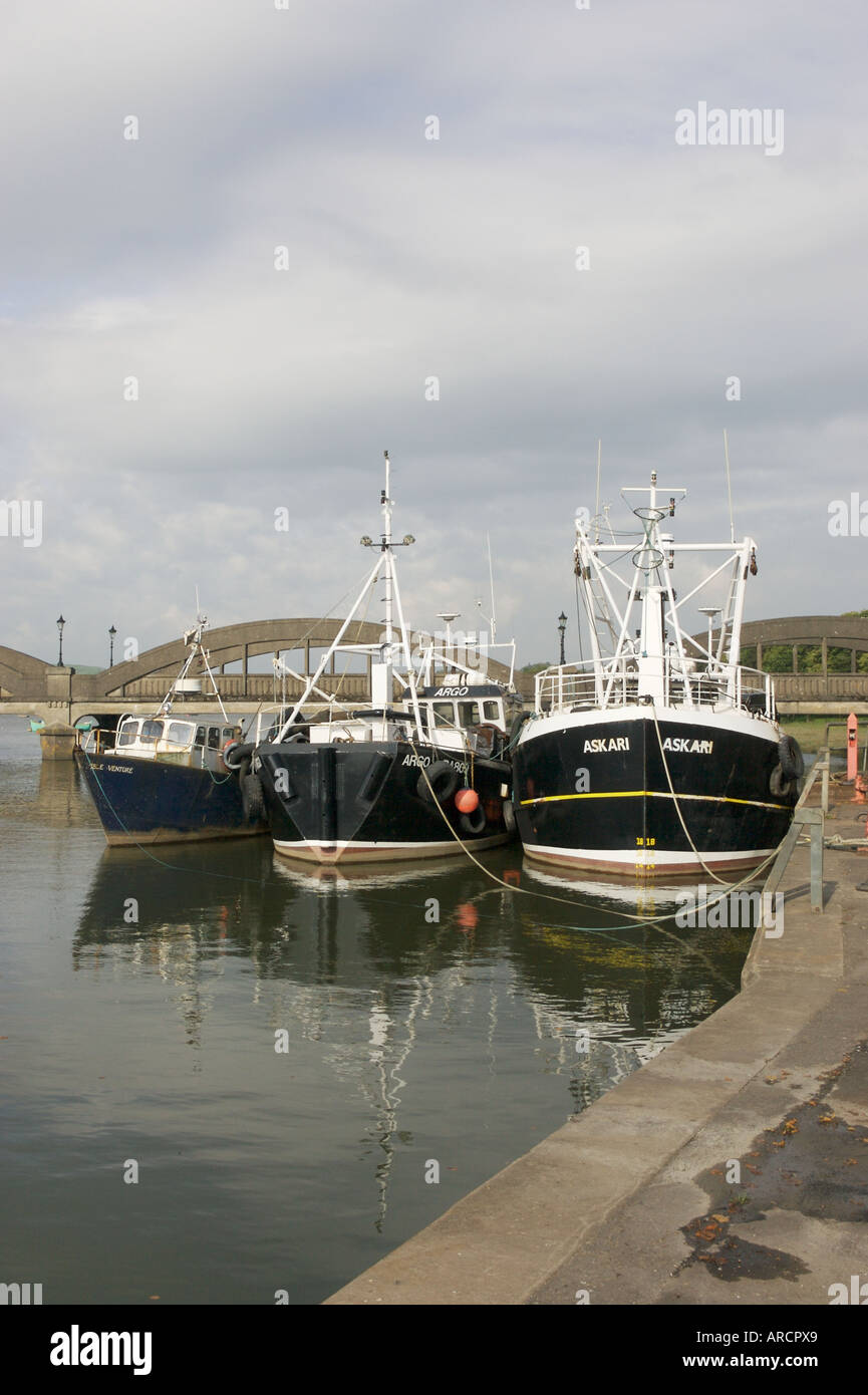 Three boats alongside Kirkcudbright Quay Stock Photo - Alamy