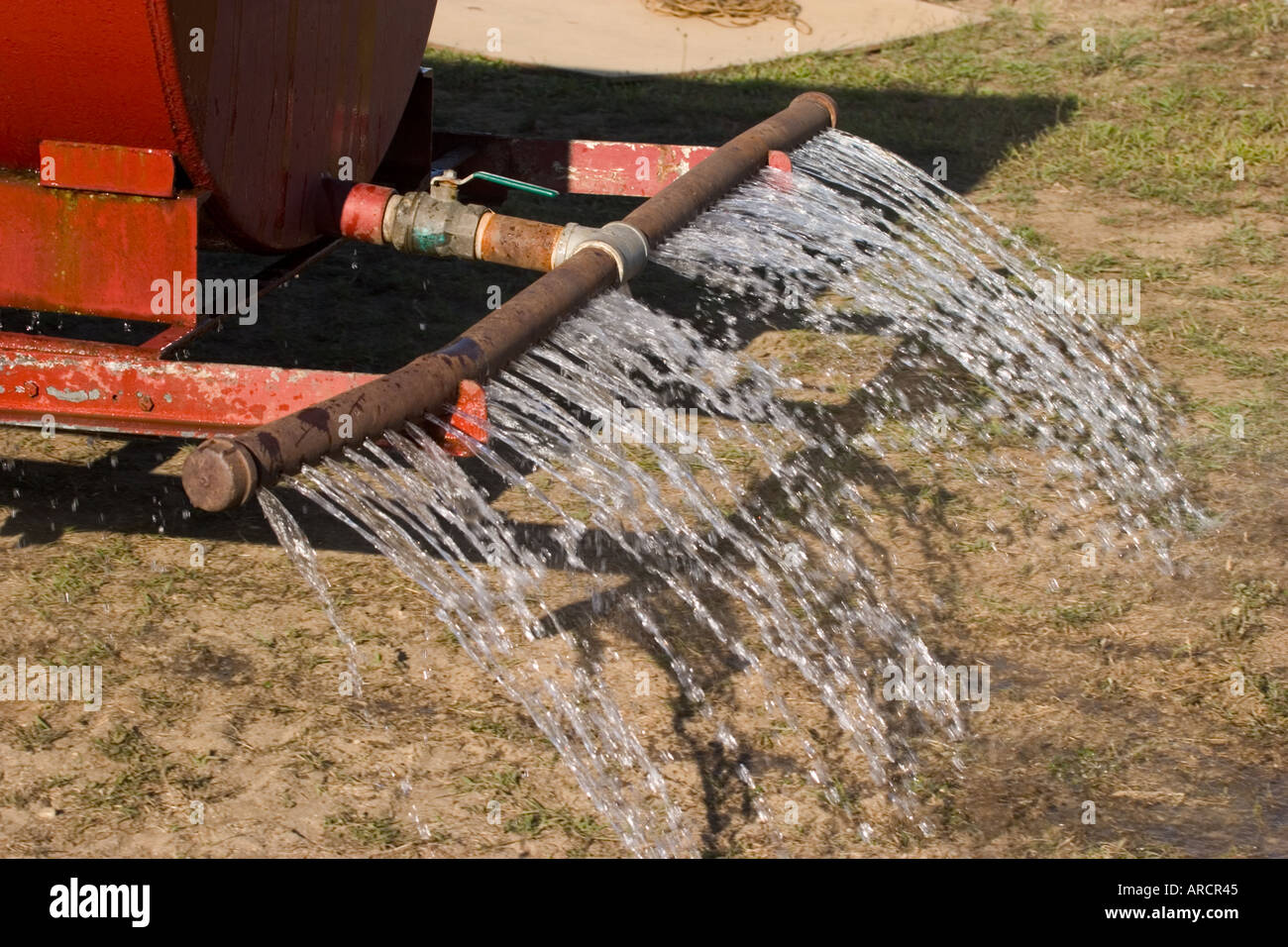 Water being released from a watering machine Stock Photo - Alamy