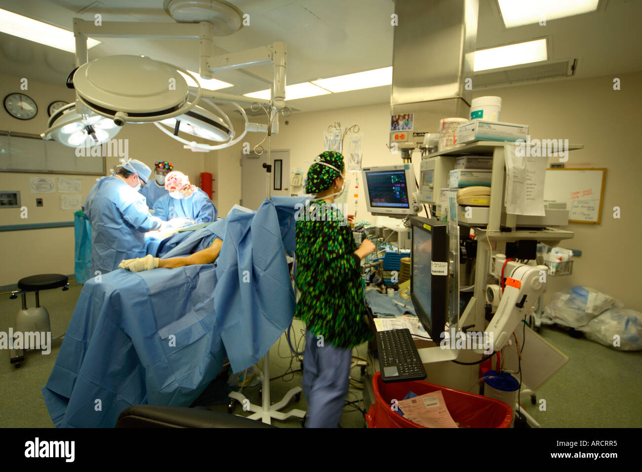 A Certified Registered Nurse Anesthetist (CRNA) inputting patient ... A Certified Registered Nurse Anesthetist (CRNA) inputting patient ...