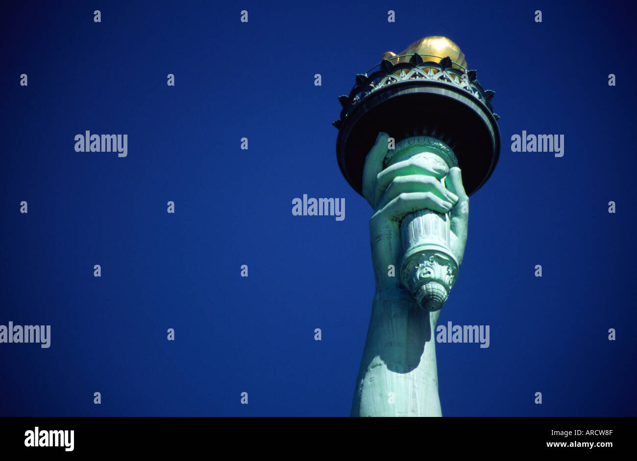 Arm and hand of Statue of Liberty holding the torch Stock Photo - Alamy