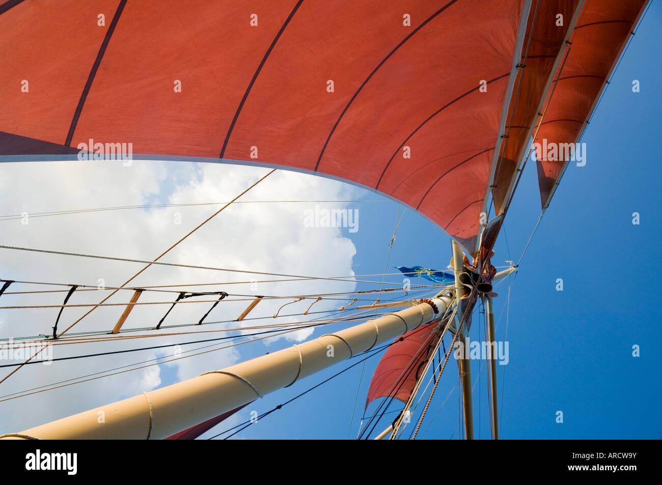 Red sails on sailboat that takes tourists out for sunset cruise, Key ...