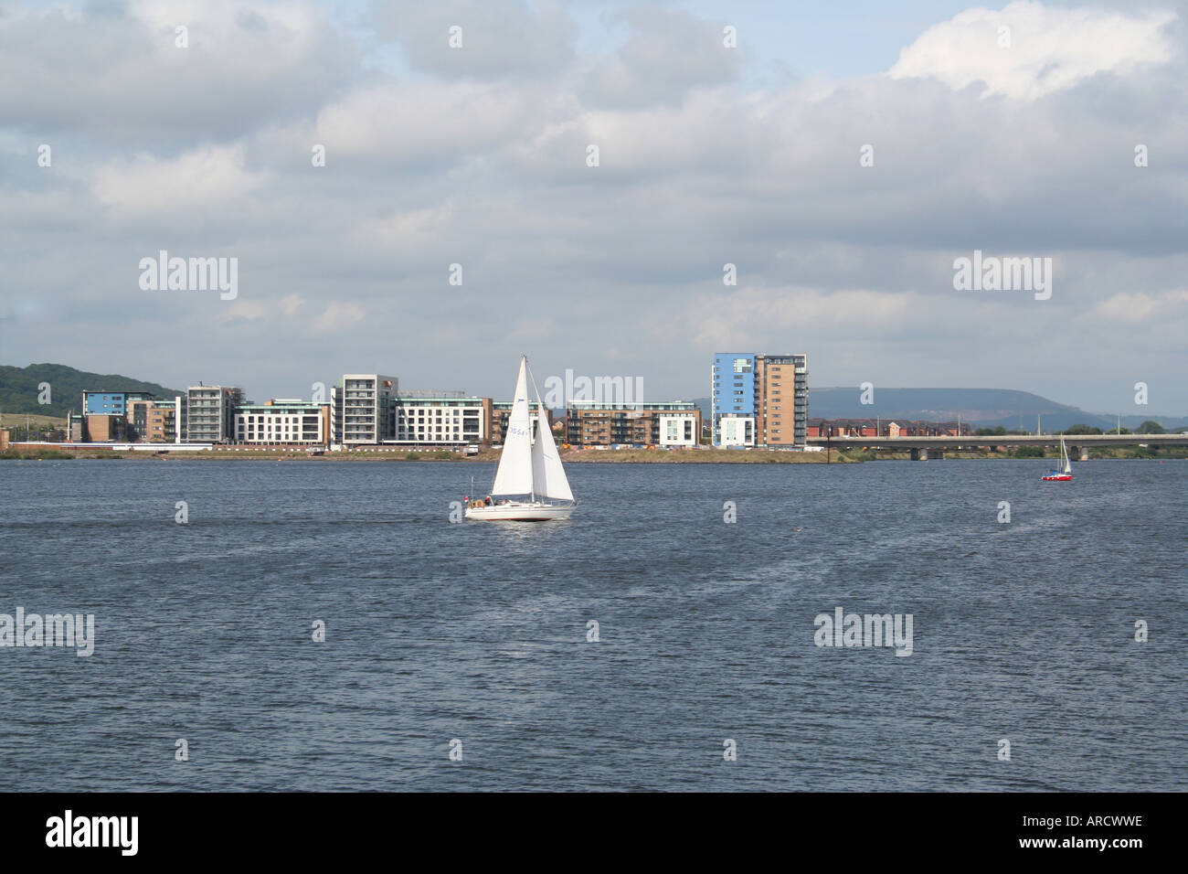 Sail Boat Passing the New Sports Village Development Cardiff Bay South ...