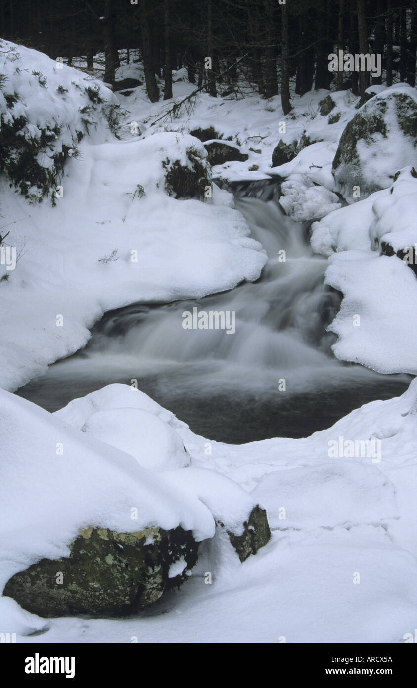 Snow covered stream Stock Photo - Alamy