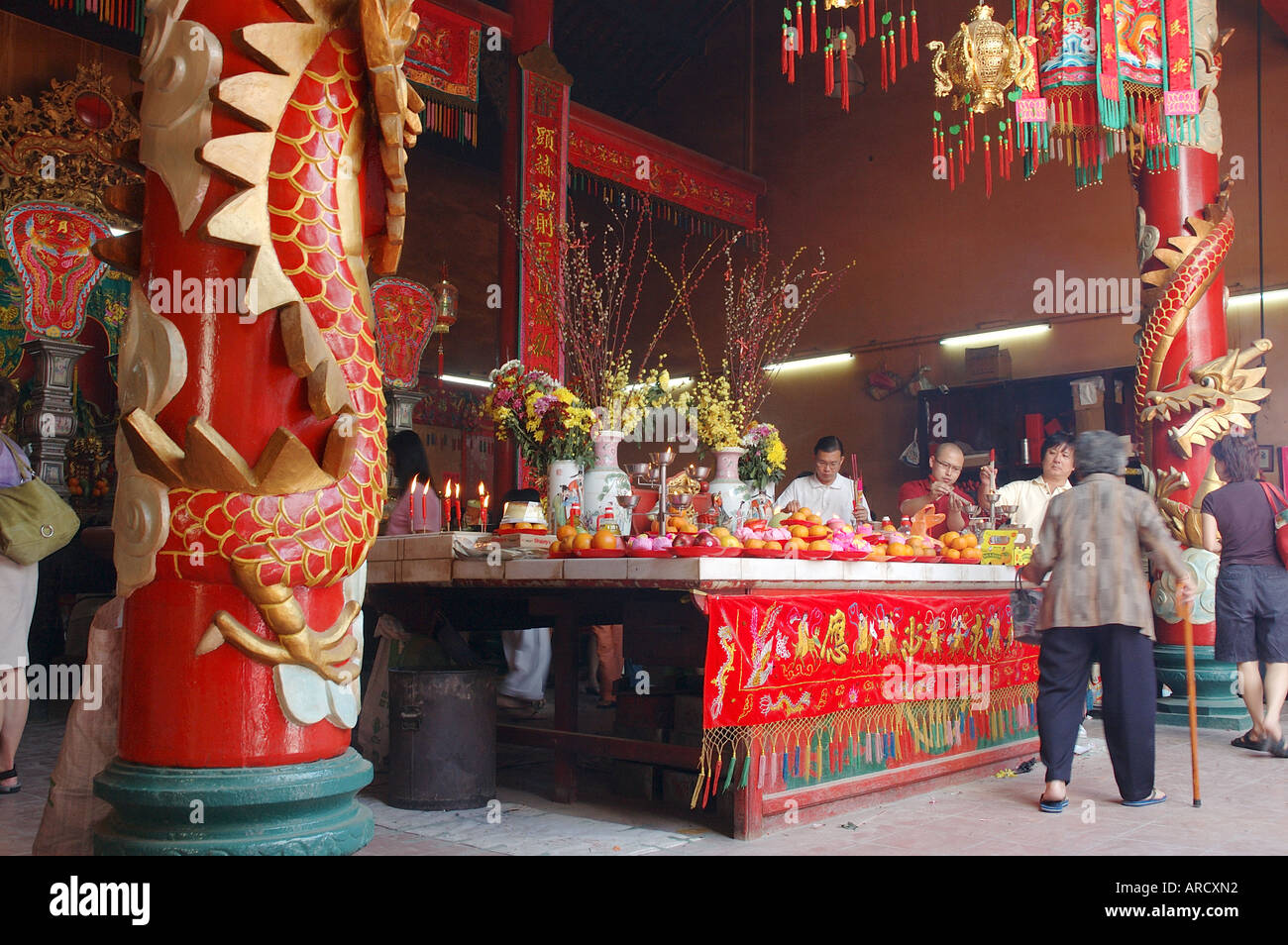 Chinese man praying with jossticks altars Stock Photo - Alamy