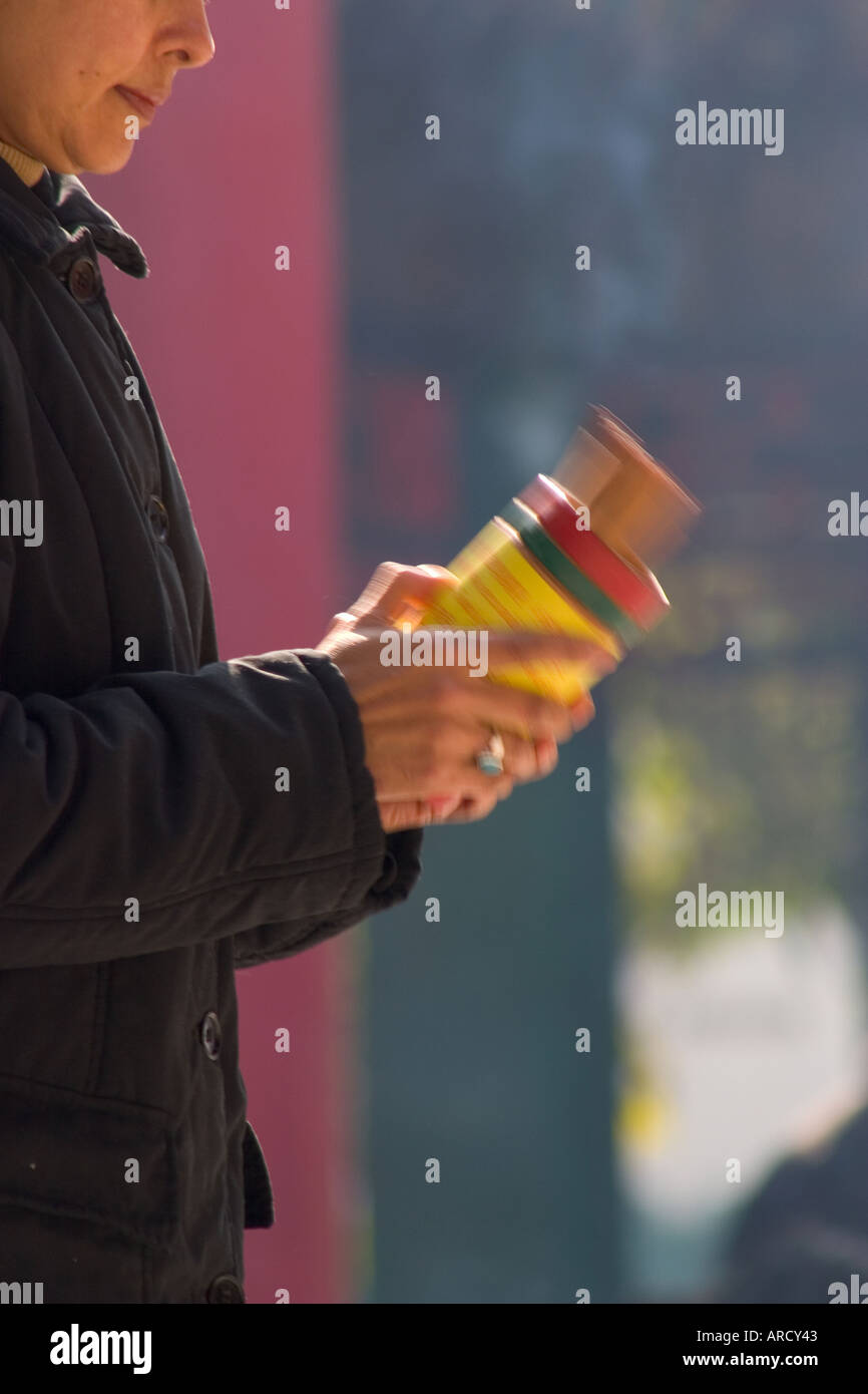 Woman Shaking Taoist Fortune Sticks - Color Stock Photo - Alamy