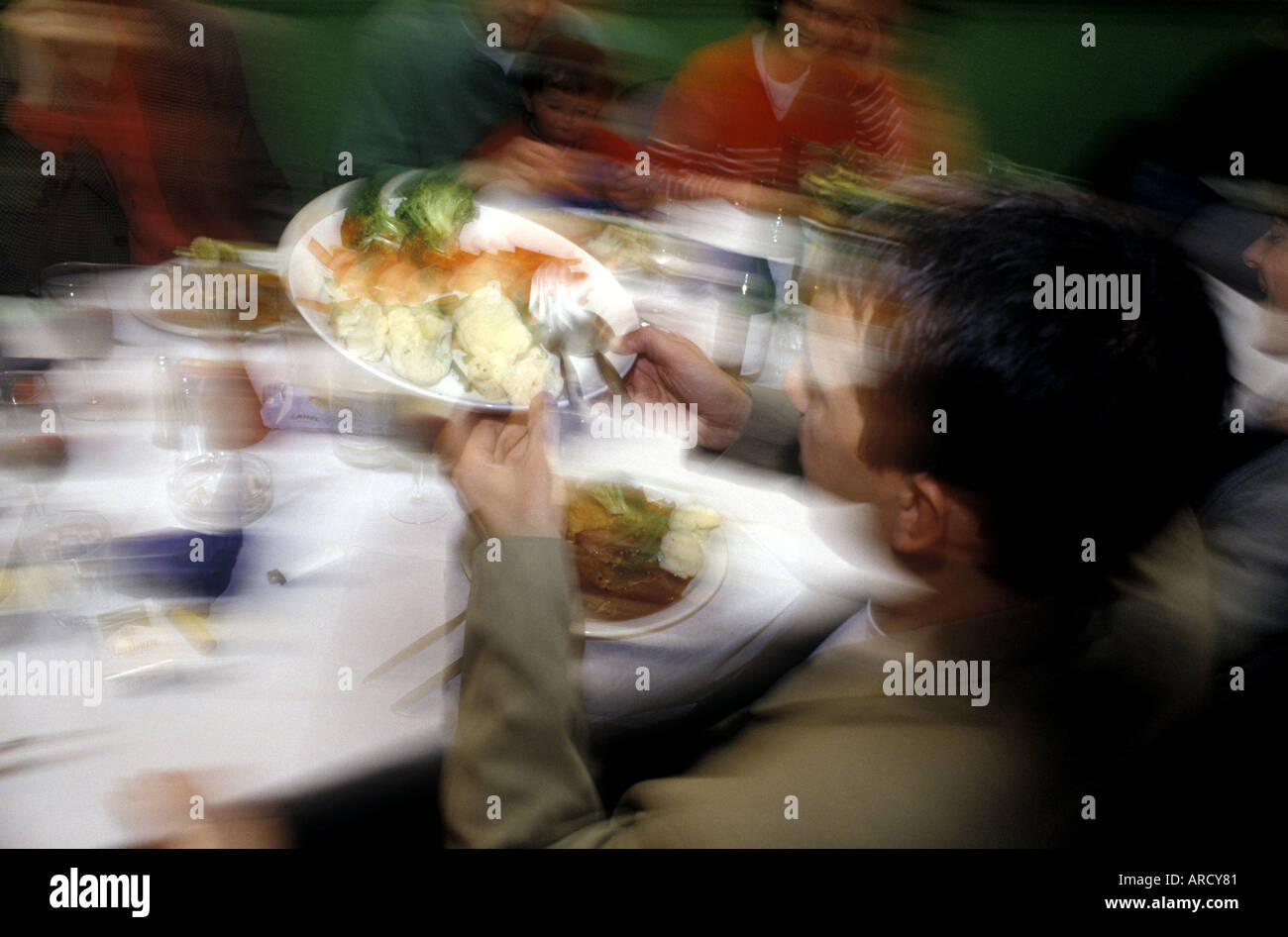 passing a plate during a meal Stock Photo - Alamy