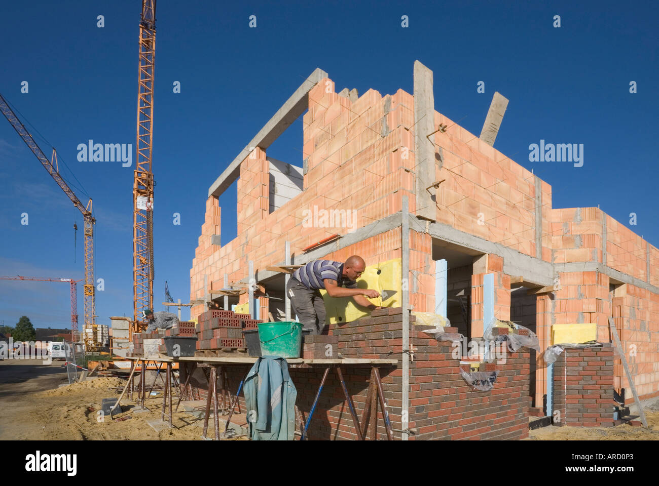 Bricklayers at work on a building site at a new residential area Stock ...