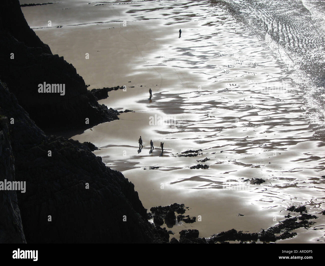 Walkers on Beach Mewslade Bay Gower South Wales Stock Photo - Alamy
