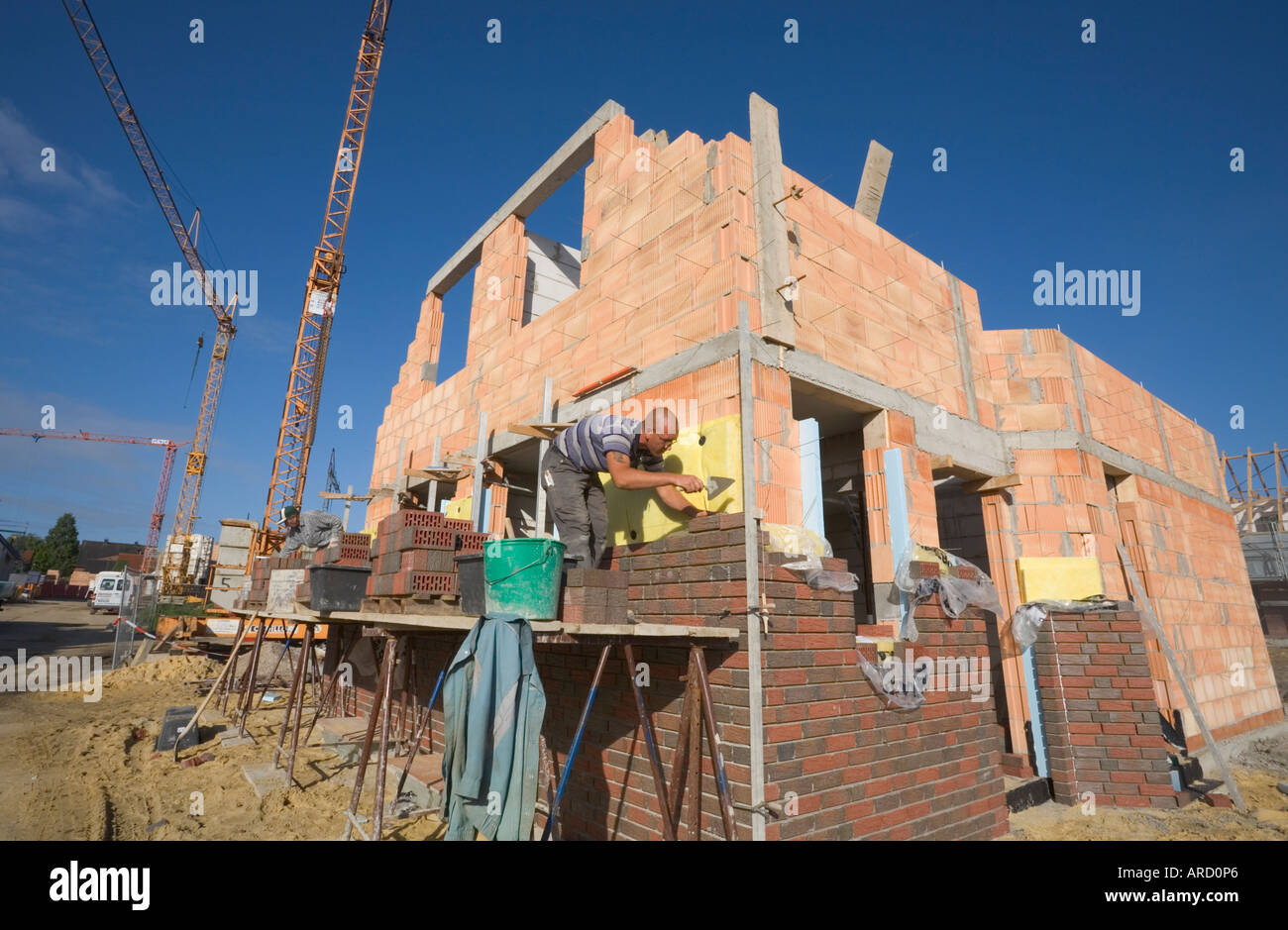 Bricklayers at work on a building site at a new residential area Stock ...
