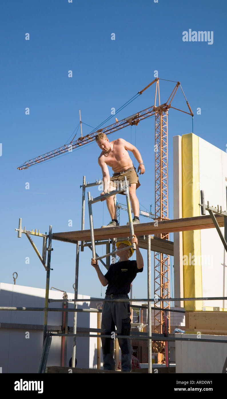 Scaffolders at work on a prefabricated house construction site Stock ...