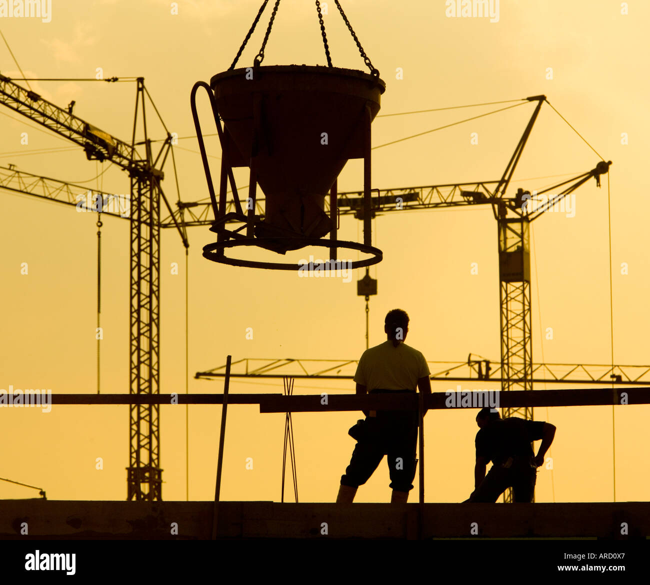 Building labourers at work on a construction site Stock Photo - Alamy