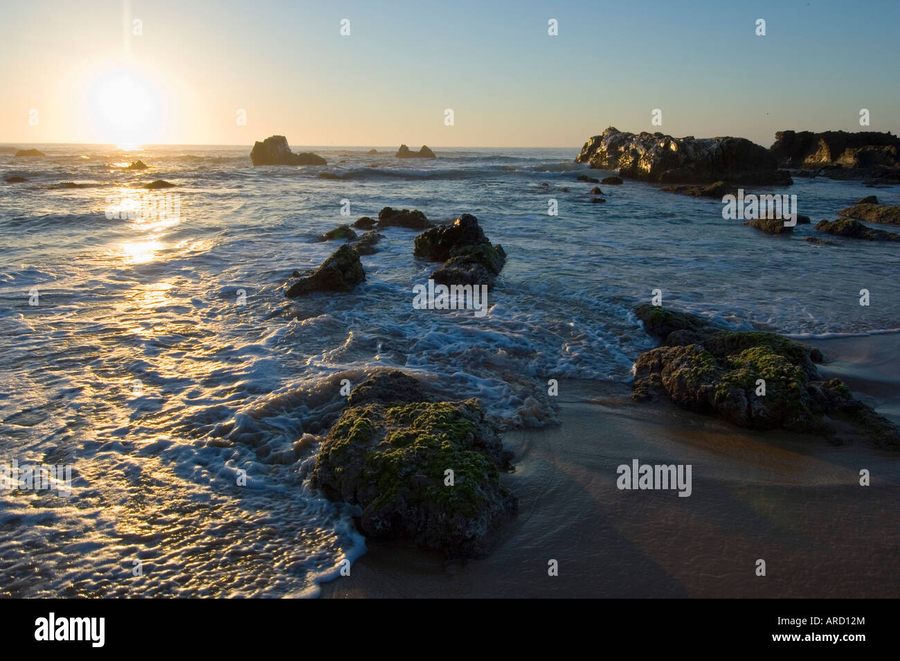 Sunrise over rocks at Bogola Head Eurobadalla National Park New South ...