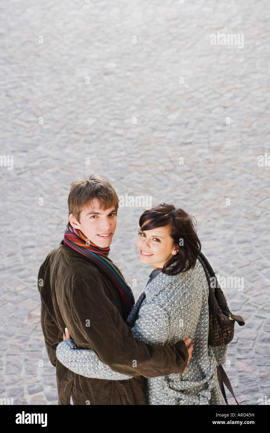 Man and woman looking back at camera Stock Photo - Alamy