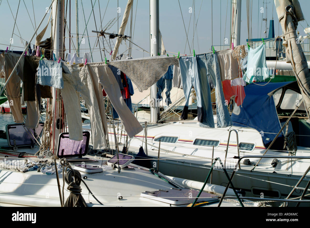 clothes drying on line on boat in harbour Stock Photo - Alamy