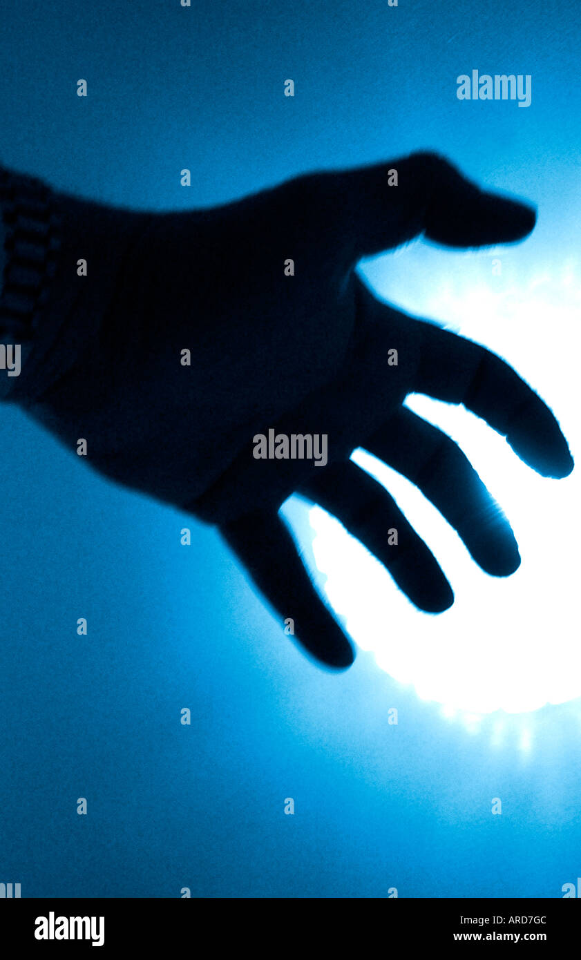 silhouette of hand against bright light Stock Photo - Alamy