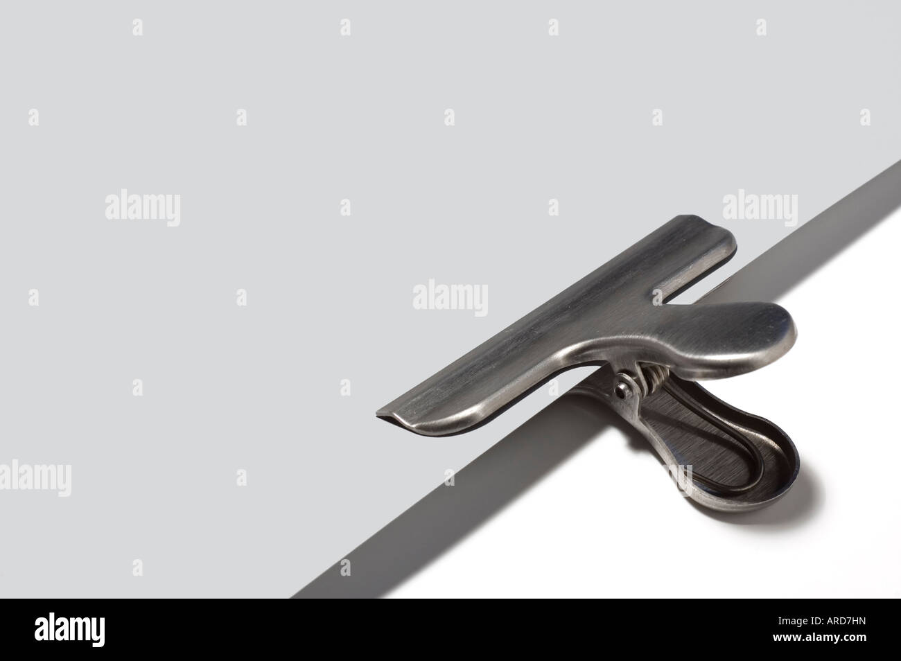 Metallic paperclip on grey paper Use it on the bottom right corner of ...