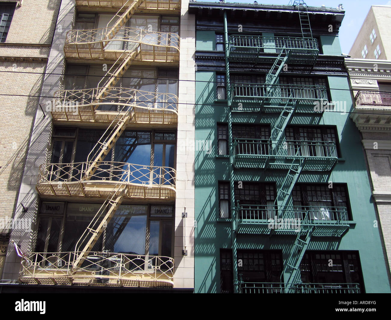 Shadows cast by fire escapes from apartment buildings, San Francisco ...