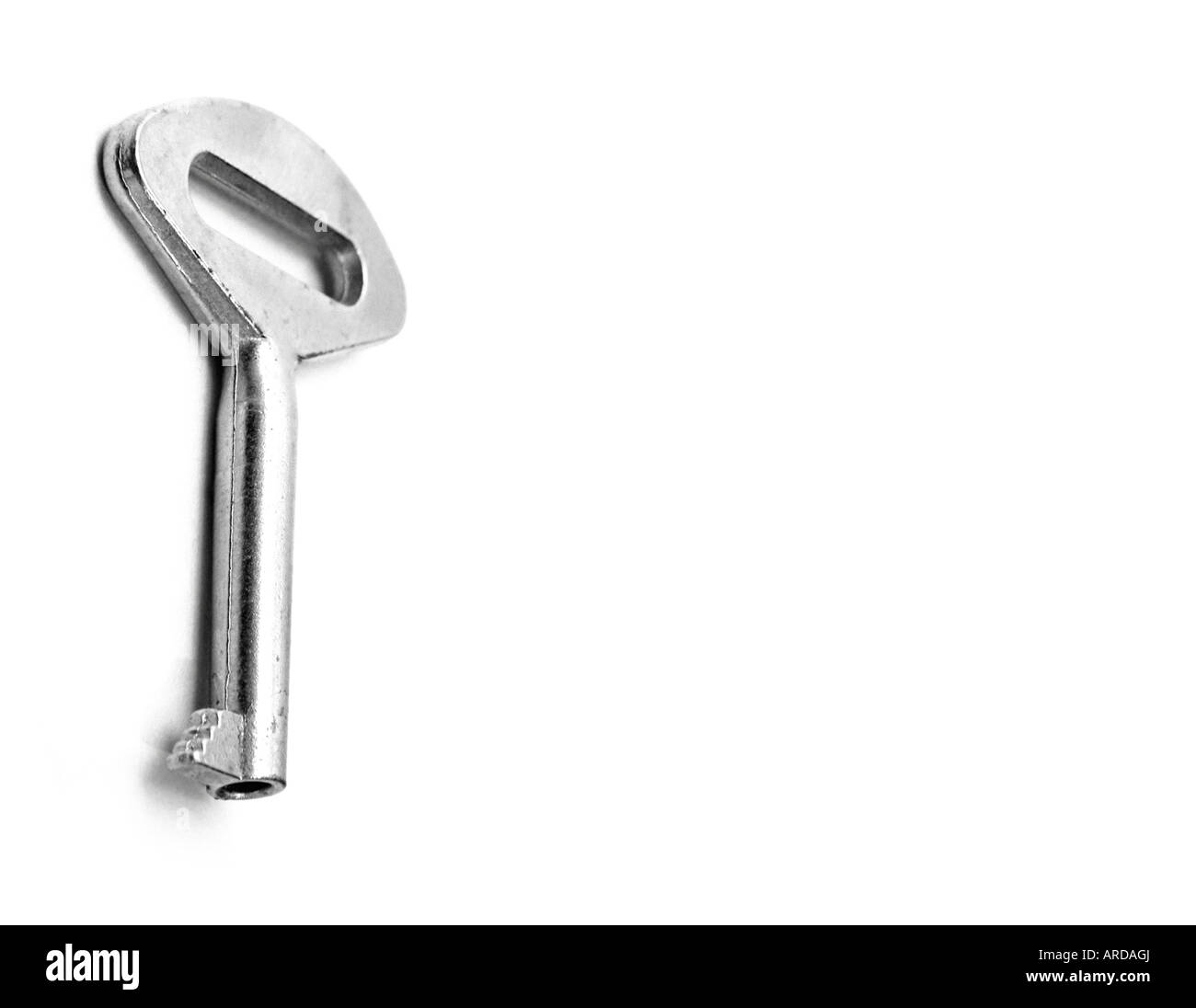 Silver key isolated on white Stock Photo - Alamy