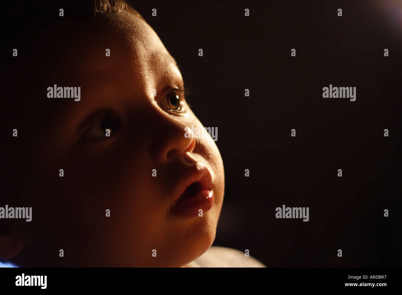 A baby is looking up Stock Photo - Alamy