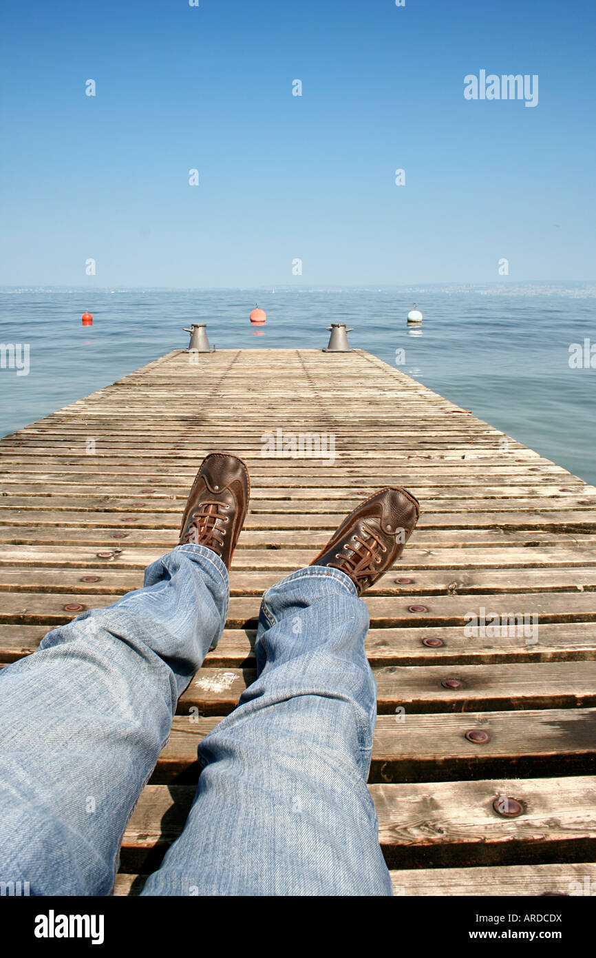 Old footbridge over blue ocean Stock Photo - Alamy