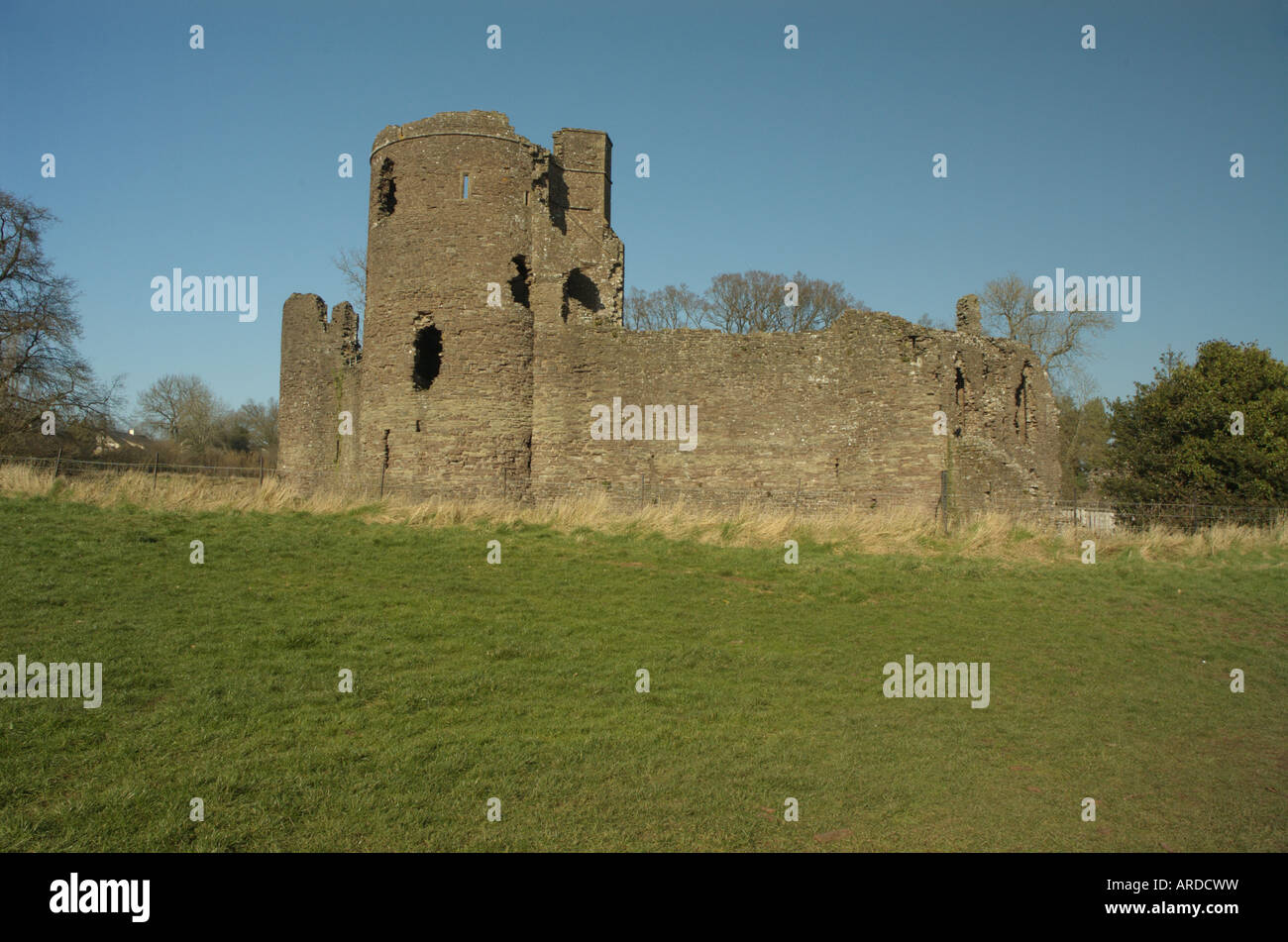 Two round towers and walls of ruined castle Stock Photo - Alamy