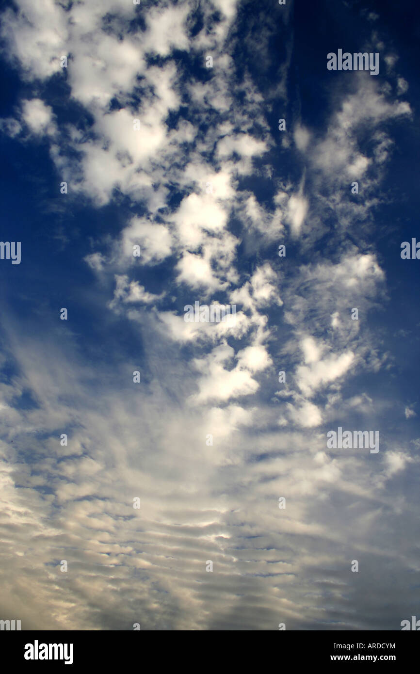 Dark blue sky with a lot of strange clouds Stock Photo - Alamy