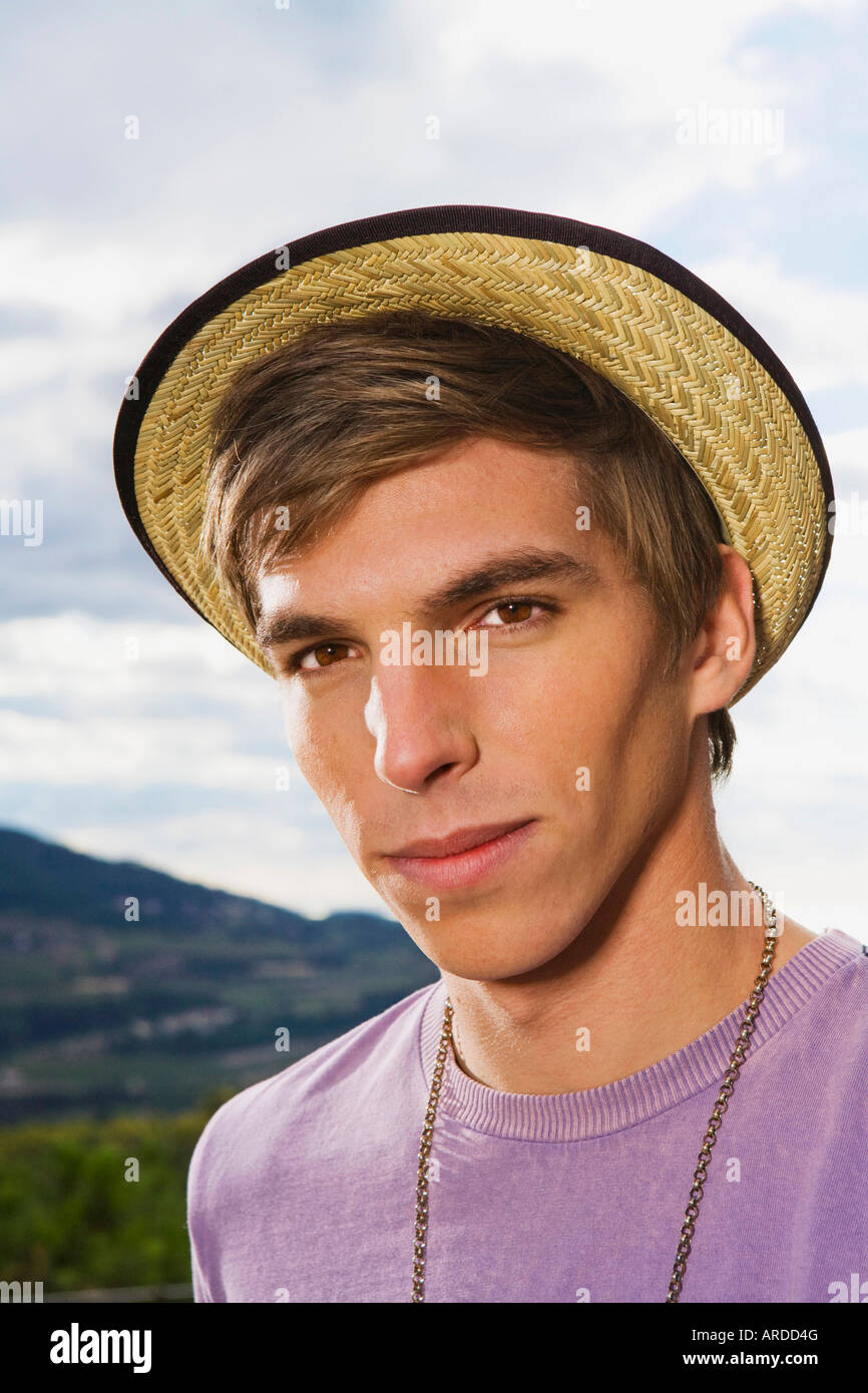 Portrait of man wearing straw hat Stock Photo - Alamy