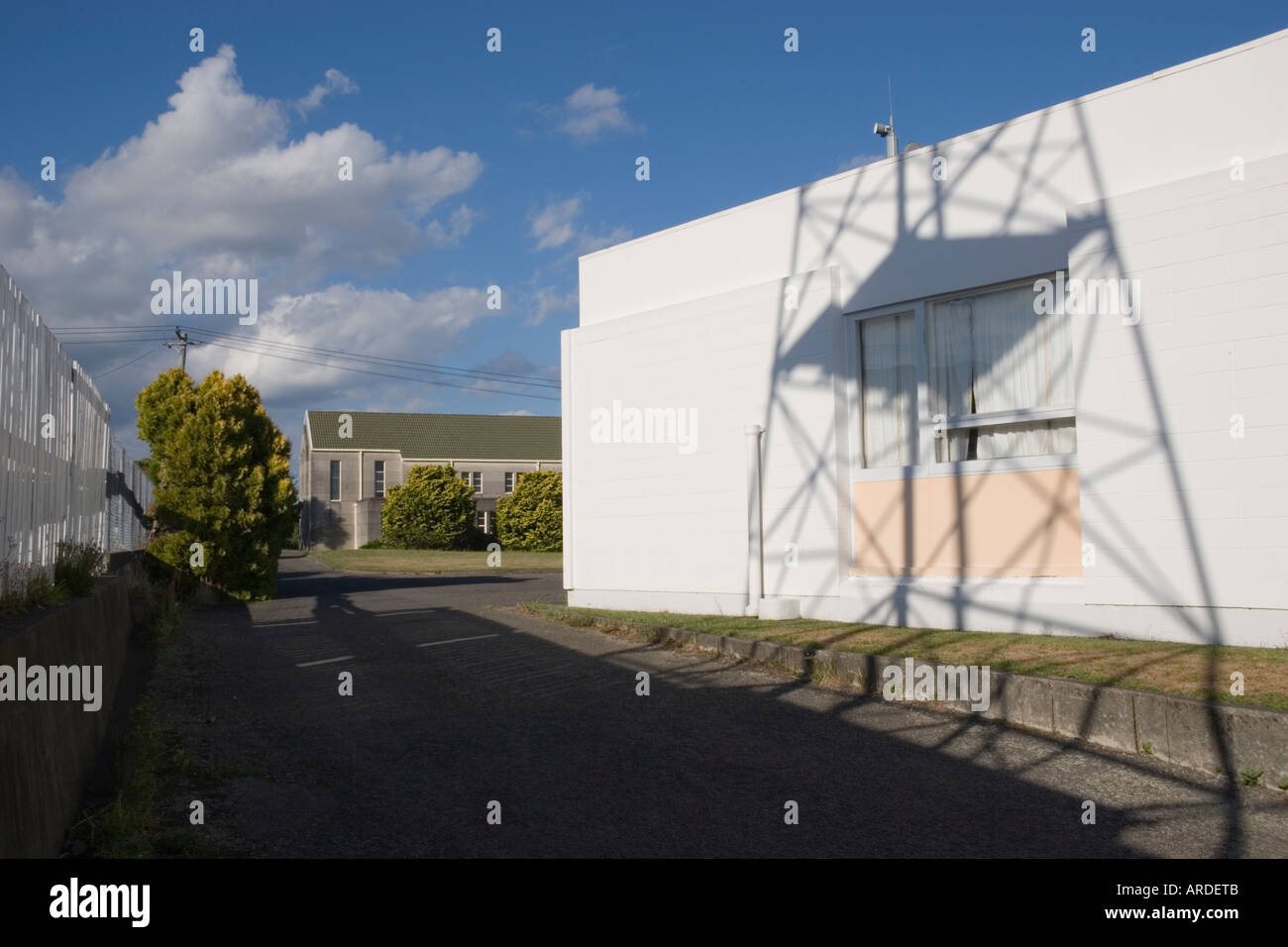 electrical tower shadow on building - 2 Stock Photo - Alamy